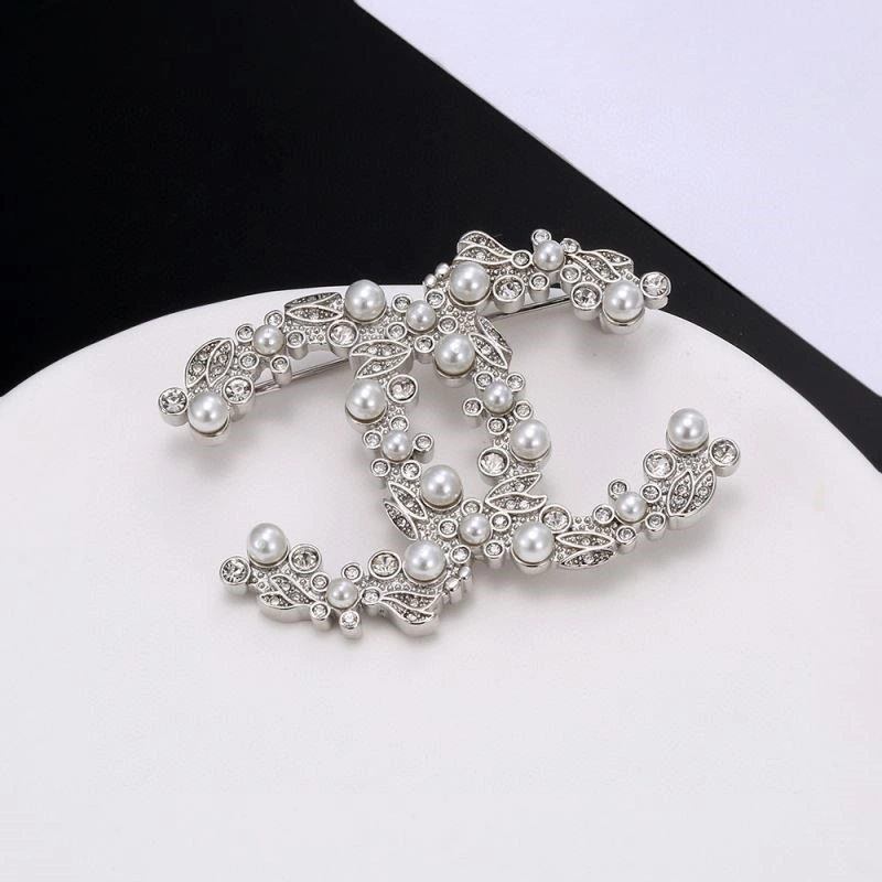 Indistinguishable Chanel Brooches