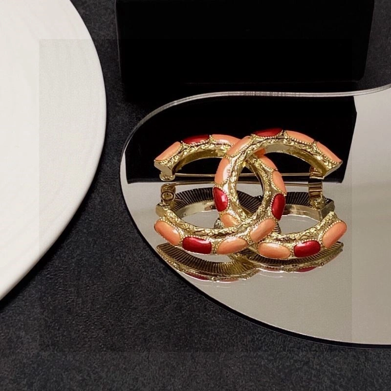 Indistinguishable Chanel Brooches
