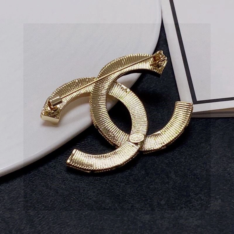 Indistinguishable Chanel Brooches