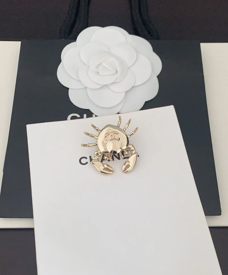 Indistinguishable Chanel Brooches