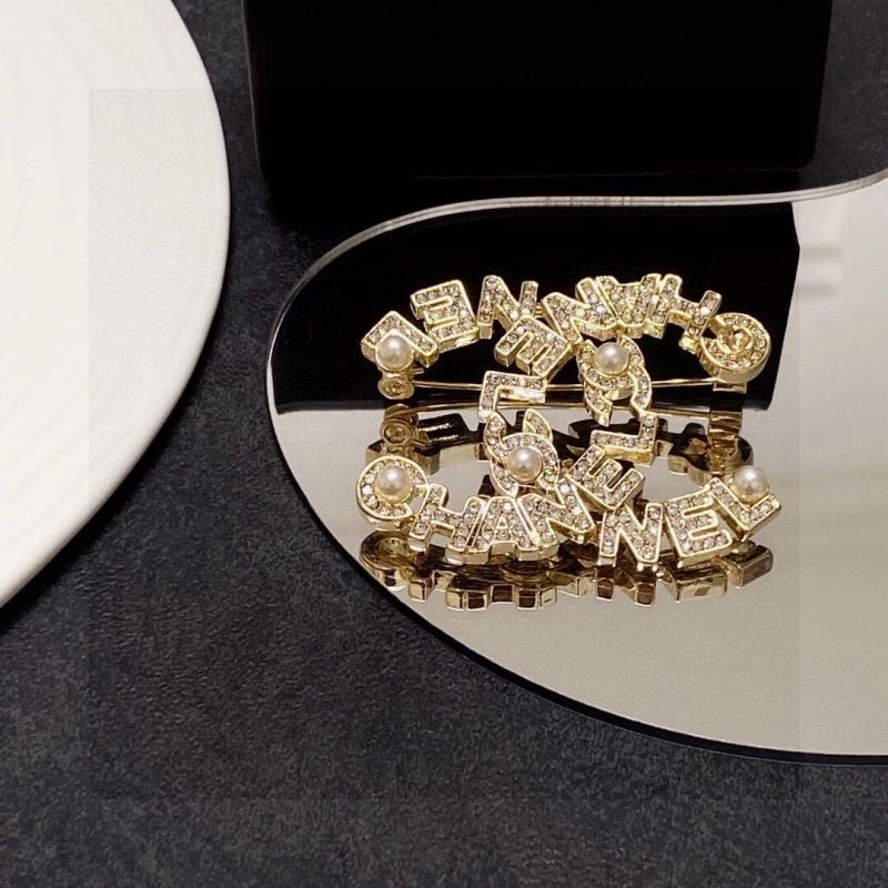 Indistinguishable Chanel Brooches