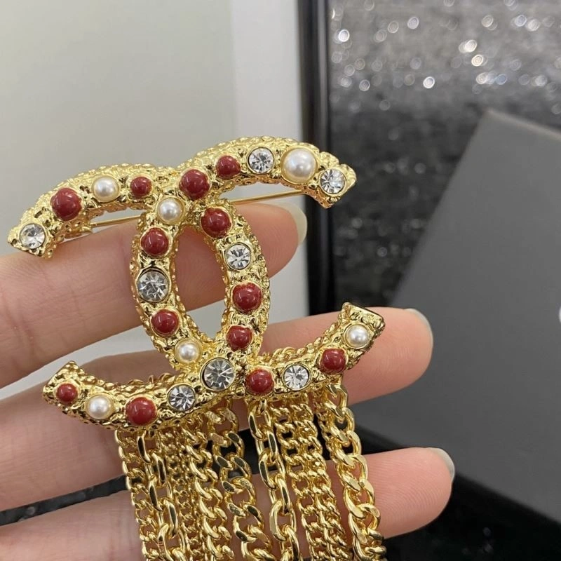Indistinguishable Chanel Brooches