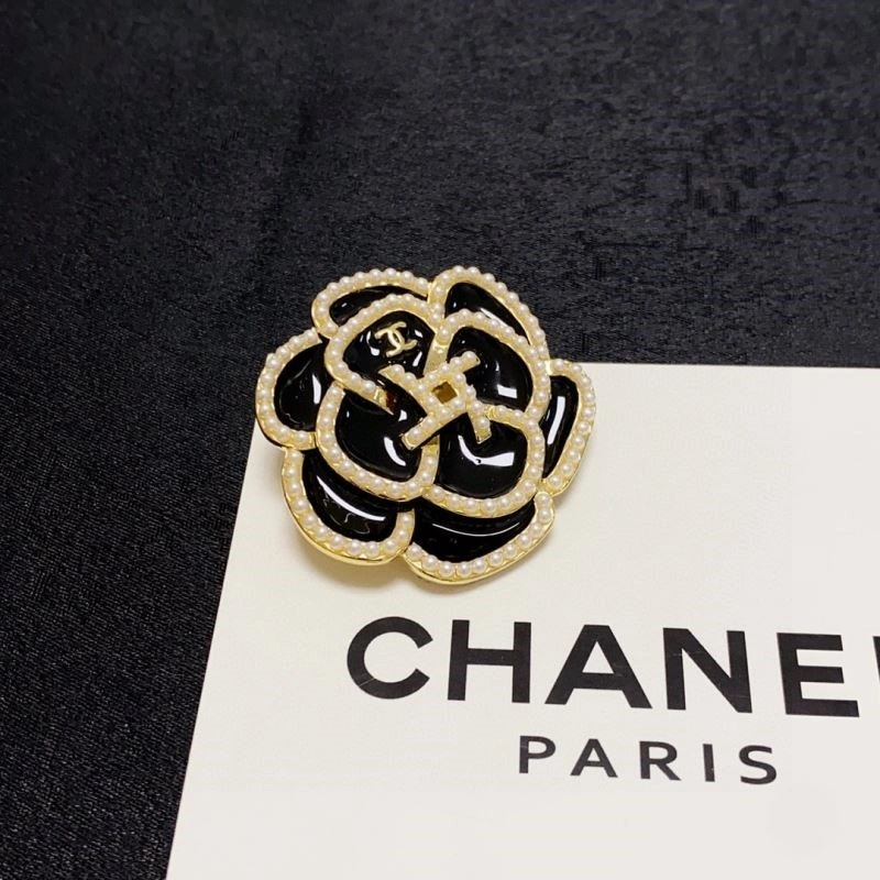 Indistinguishable Chanel Brooches