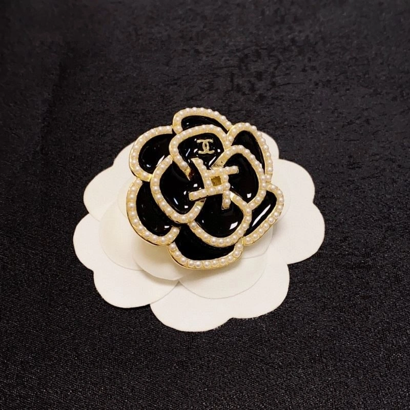 Indistinguishable Chanel Brooches