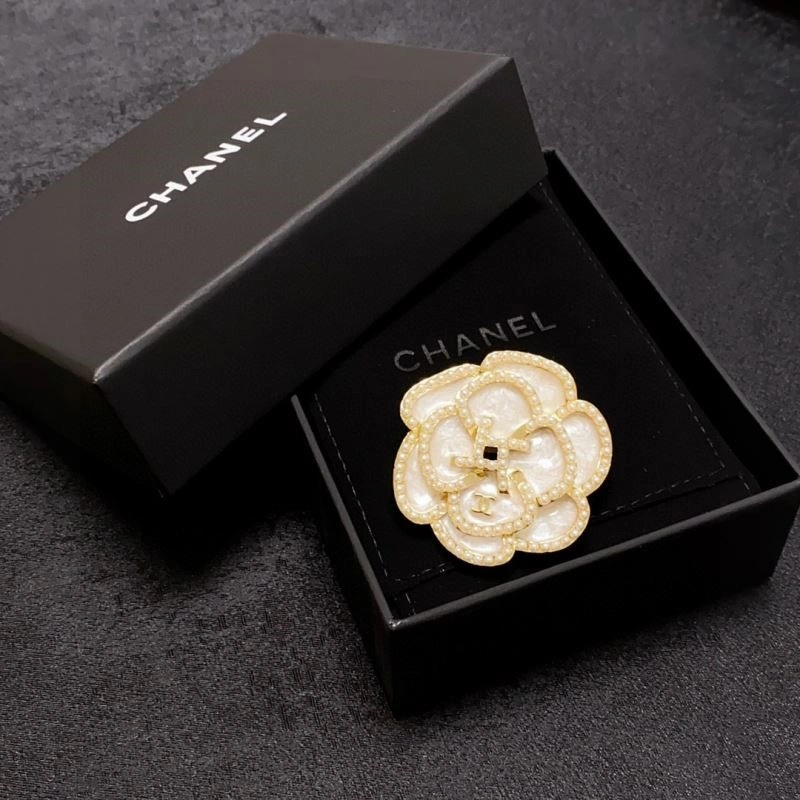 Indistinguishable Chanel Brooches