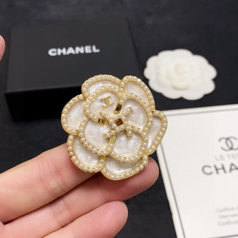 Indistinguishable Chanel Brooches