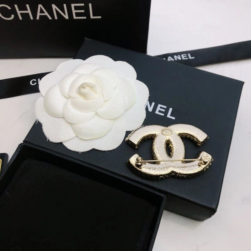 Indistinguishable Chanel Brooches