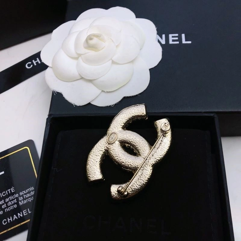 Indistinguishable Chanel Brooches
