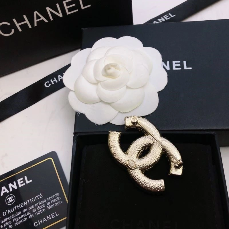 Indistinguishable Chanel Brooches