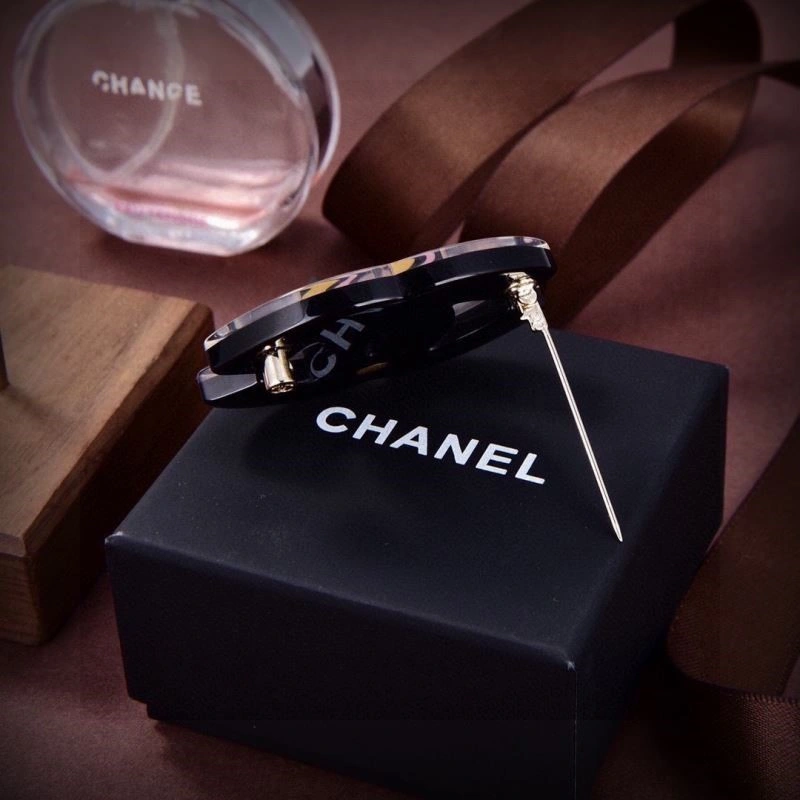 Indistinguishable Chanel Brooches