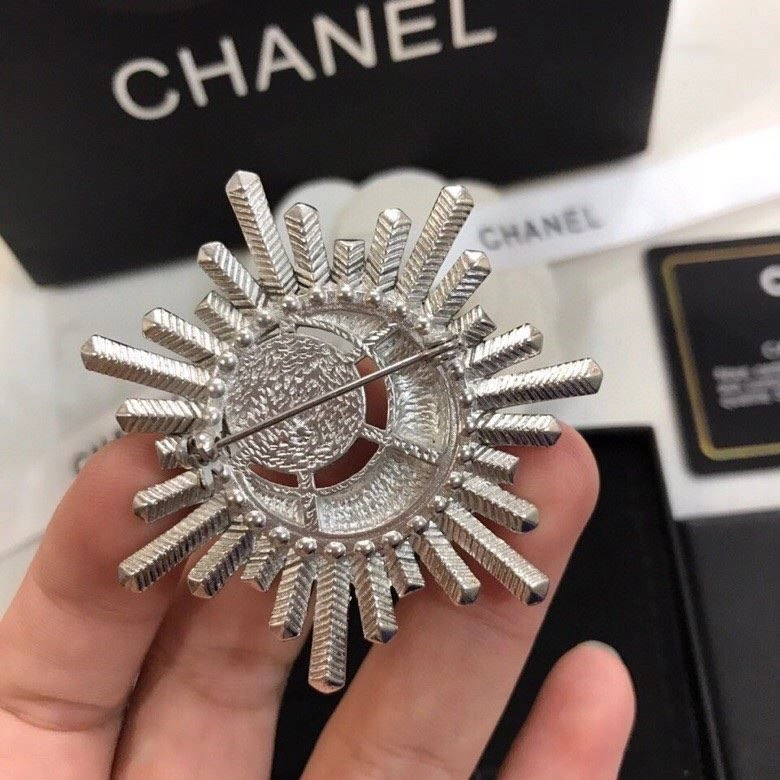 Cut-rate Chanel Brooches