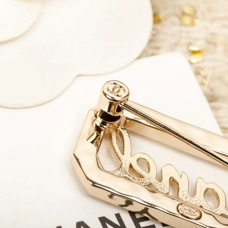 Indistinguishable Chanel Brooches