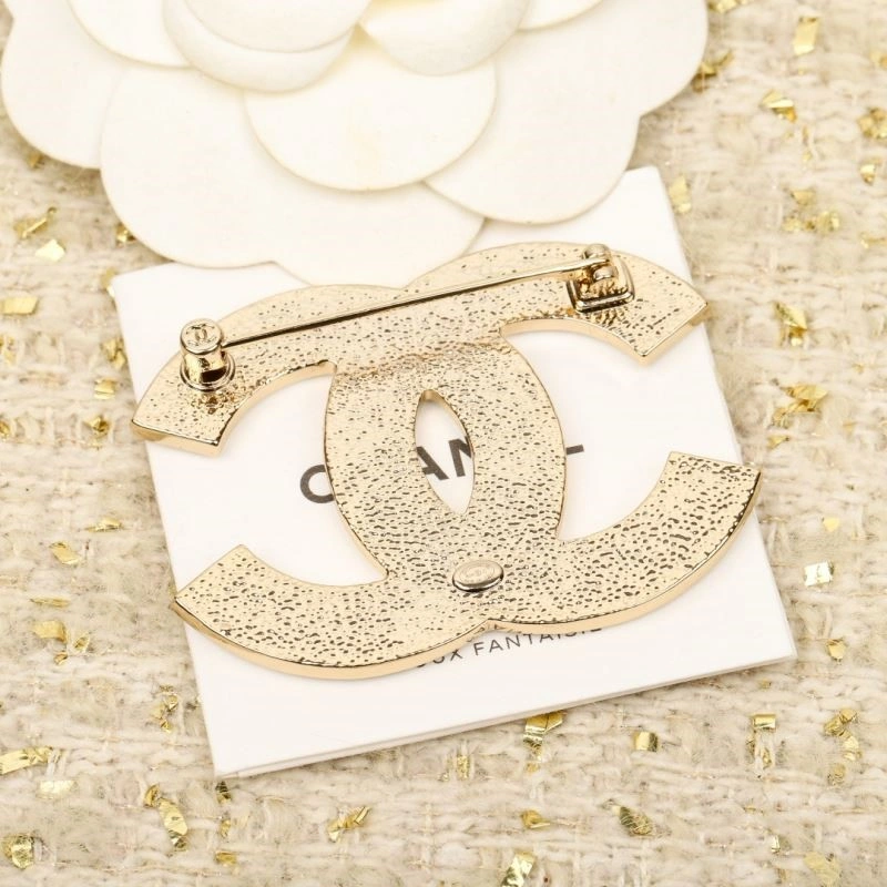 Indistinguishable Chanel Brooches