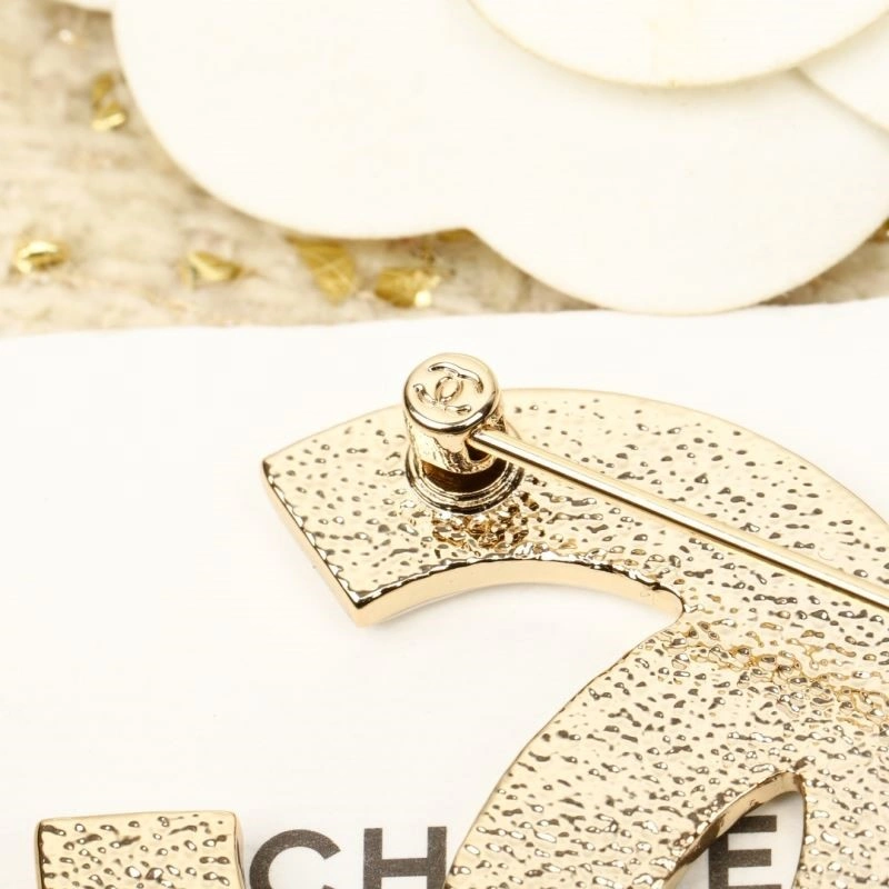 Indistinguishable Chanel Brooches