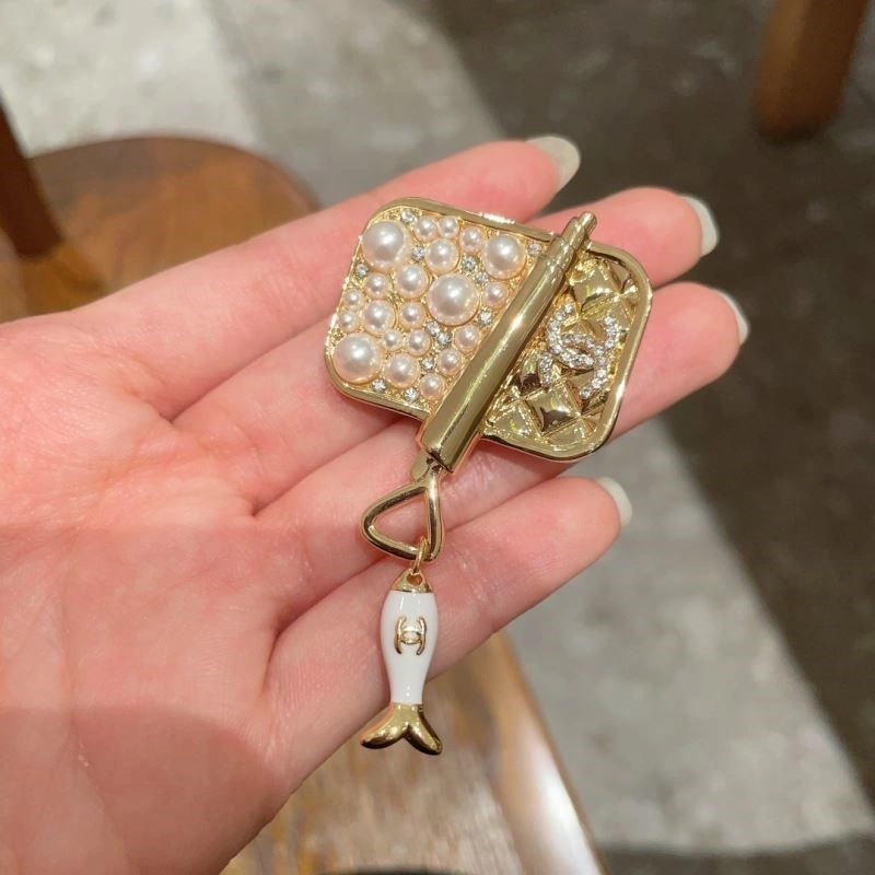 Indistinguishable Chanel Brooches