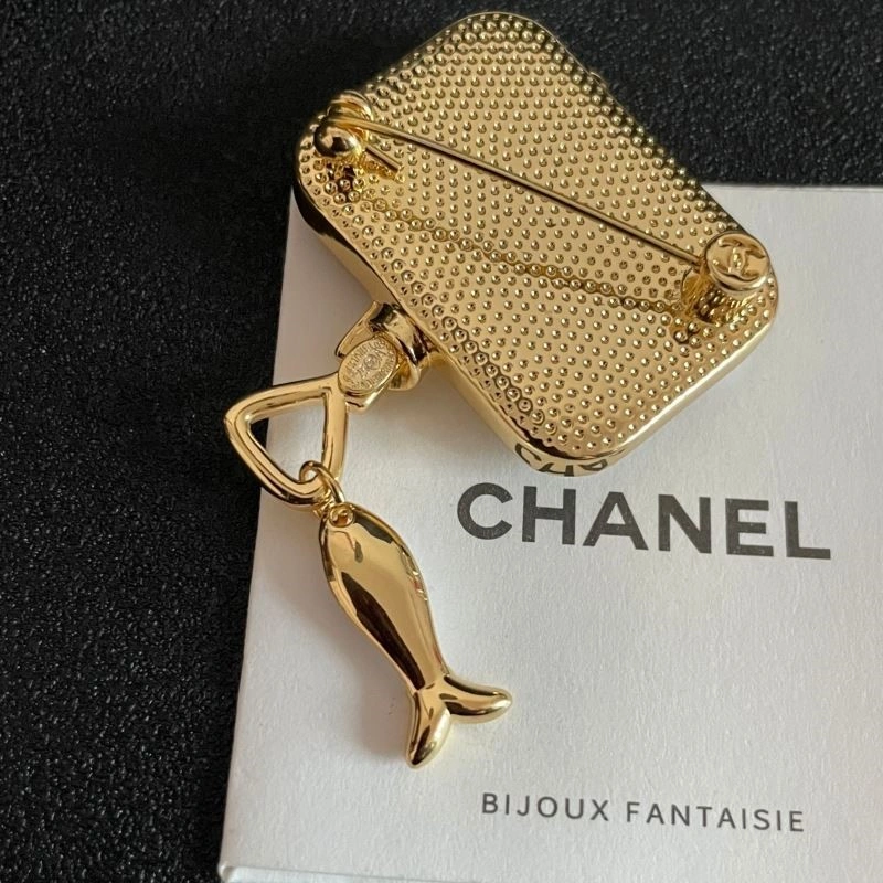 Indistinguishable Chanel Brooches