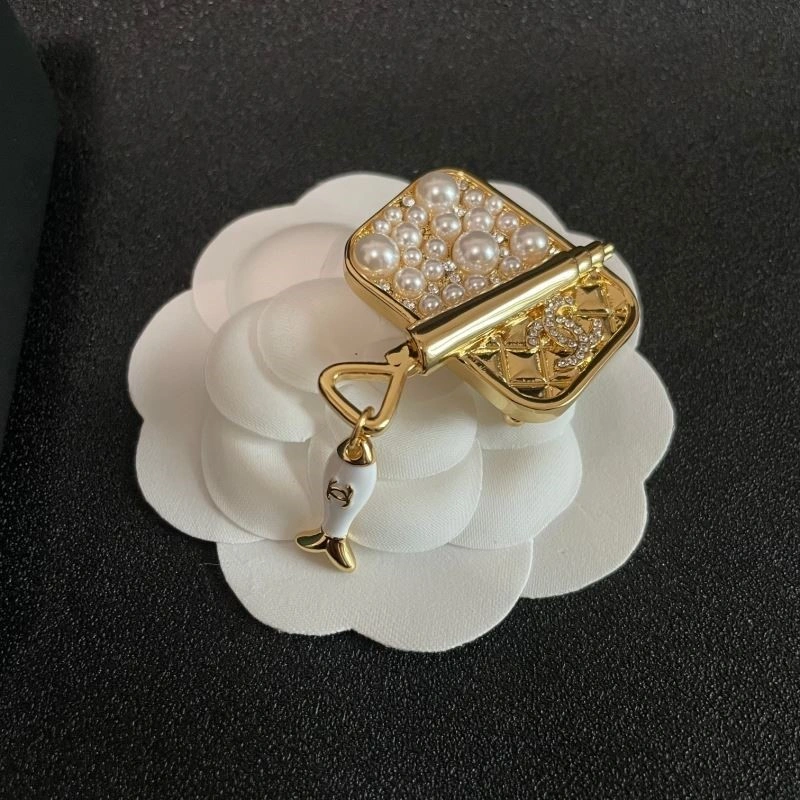 Indistinguishable Chanel Brooches