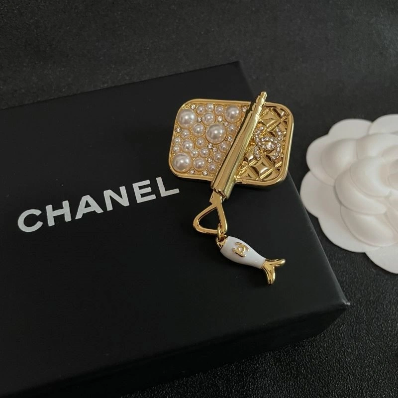 Indistinguishable Chanel Brooches