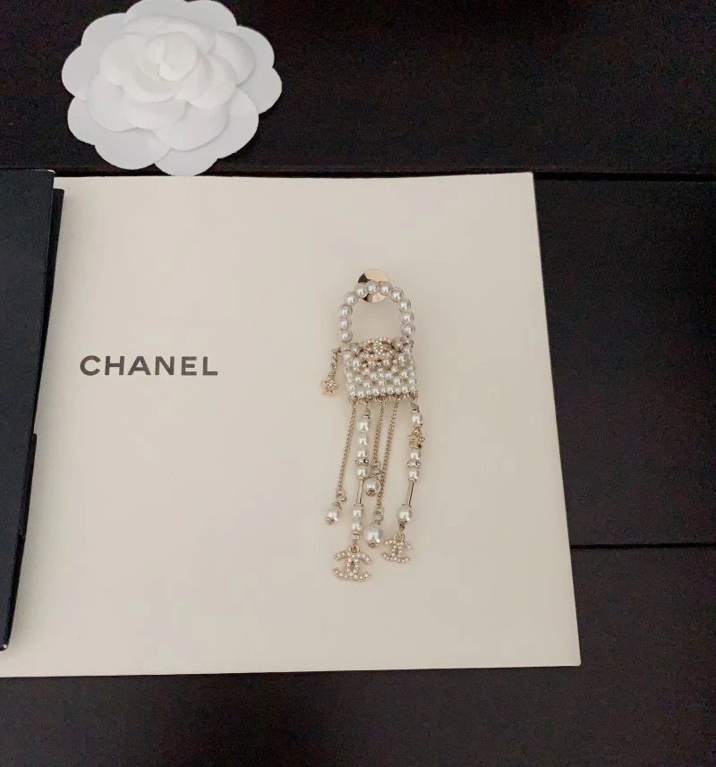 Indistinguishable Chanel Brooches