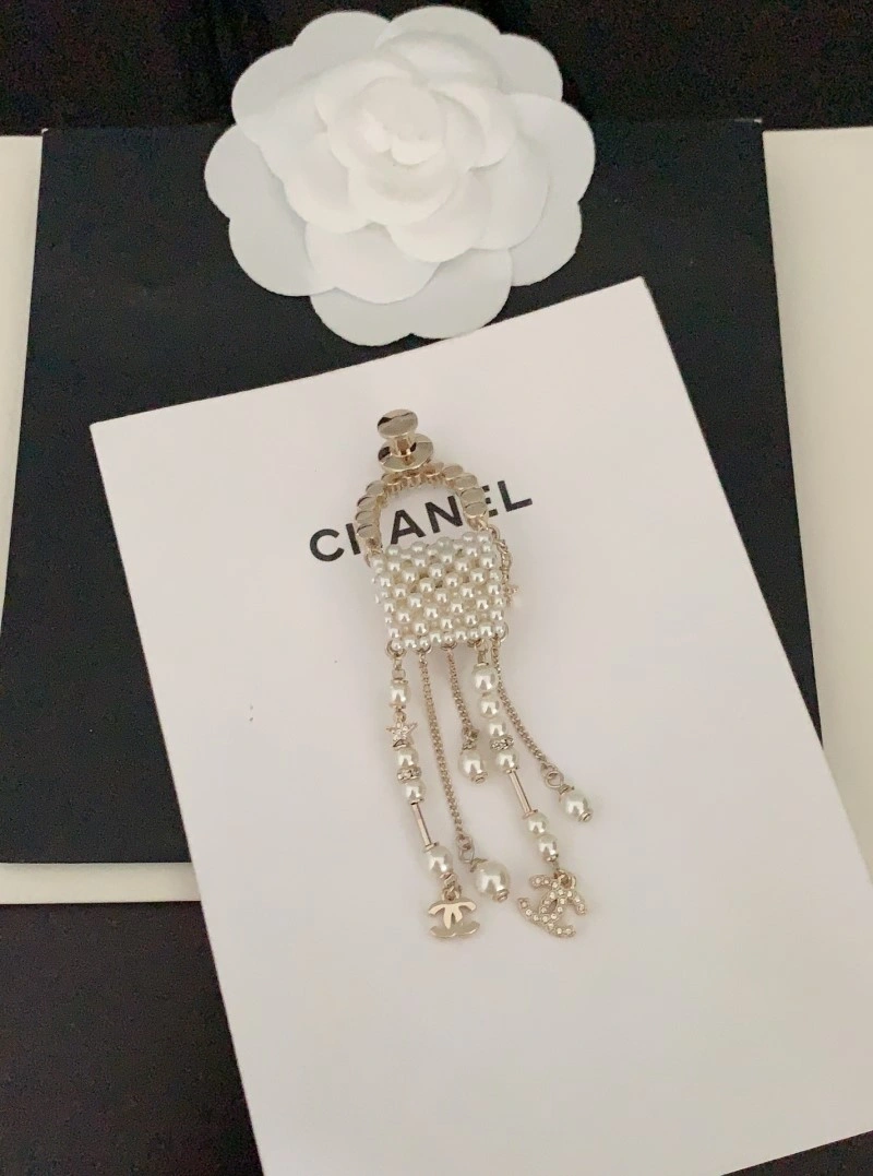 Indistinguishable Chanel Brooches