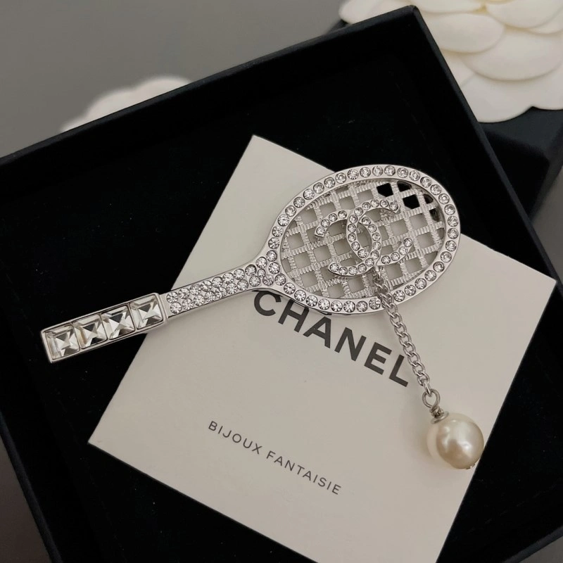 Indistinguishable Chanel Brooches