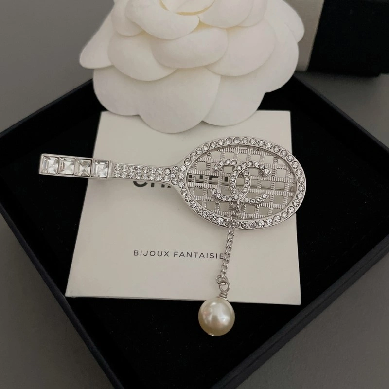 Indistinguishable Chanel Brooches