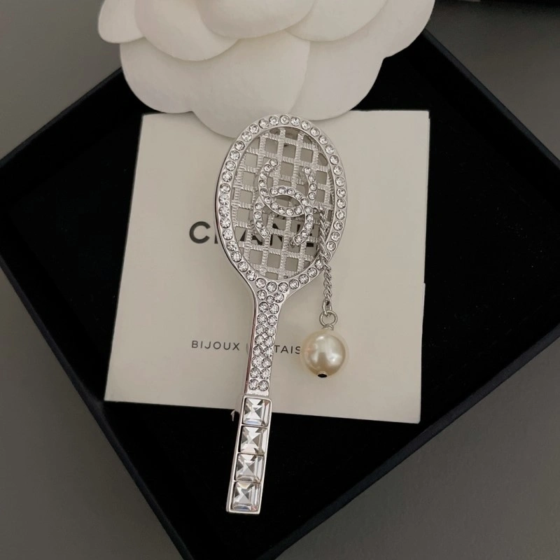 Indistinguishable Chanel Brooches