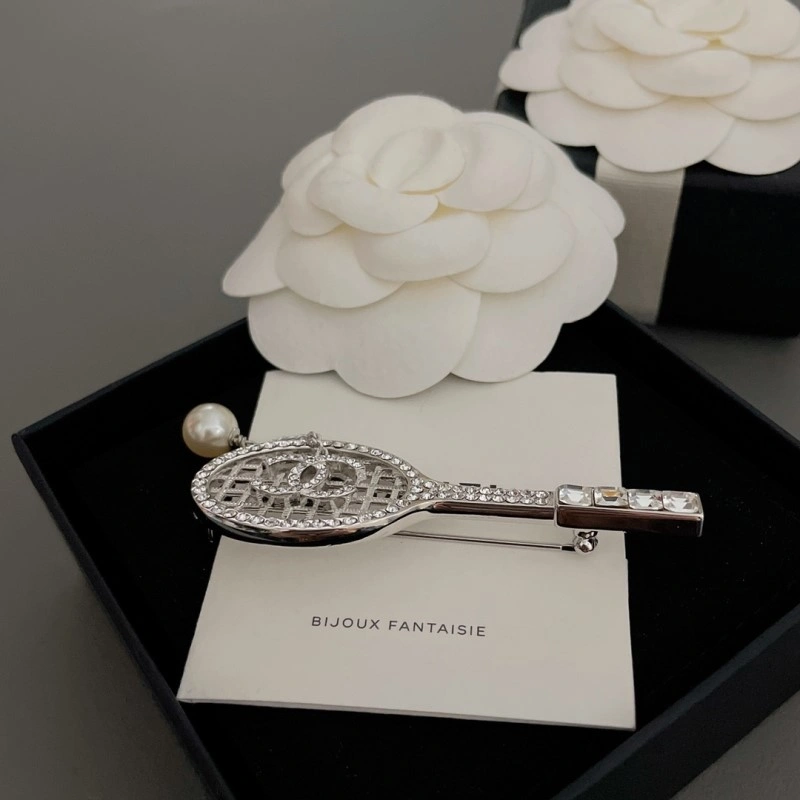 Indistinguishable Chanel Brooches