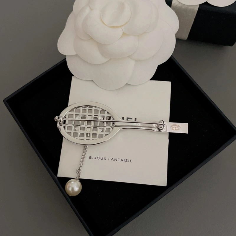 Indistinguishable Chanel Brooches