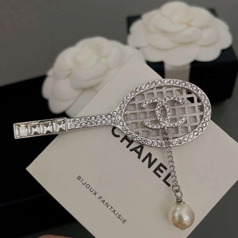 Indistinguishable Chanel Brooches