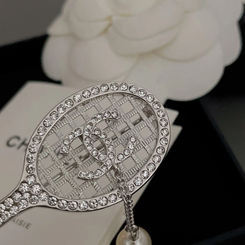 Indistinguishable Chanel Brooches