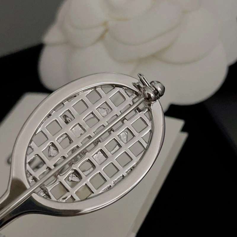 Indistinguishable Chanel Brooches
