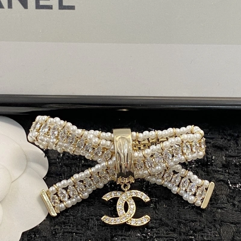 Cut-rate Chanel Brooches