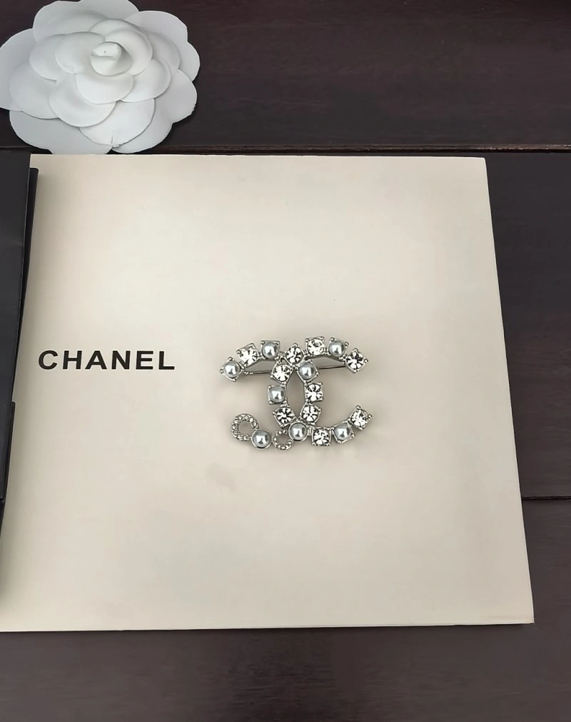 Indistinguishable Chanel Brooches