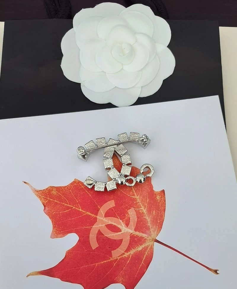Indistinguishable Chanel Brooches