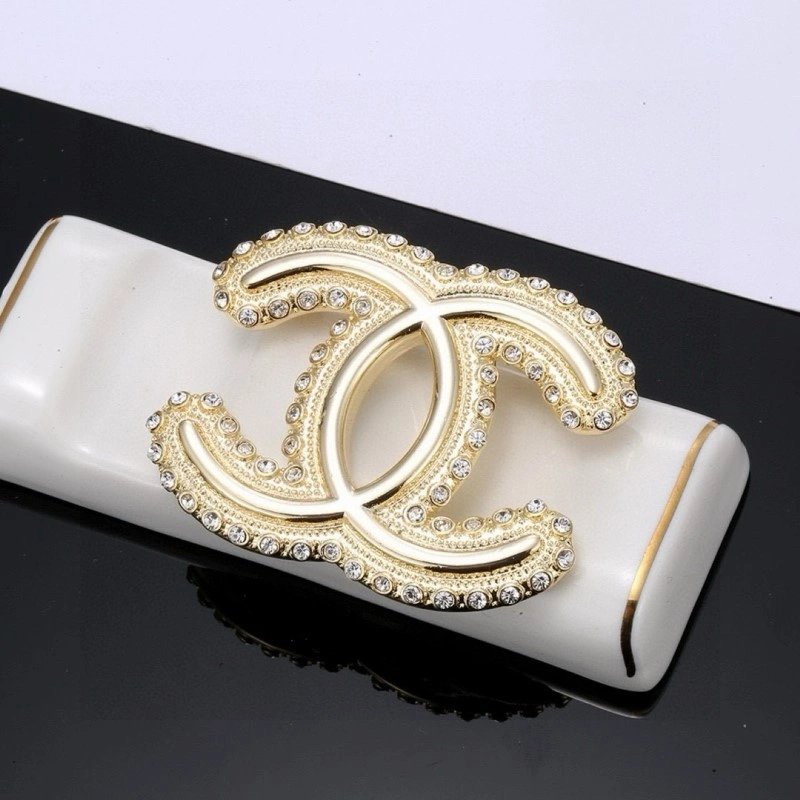 Indistinguishable Chanel Brooches