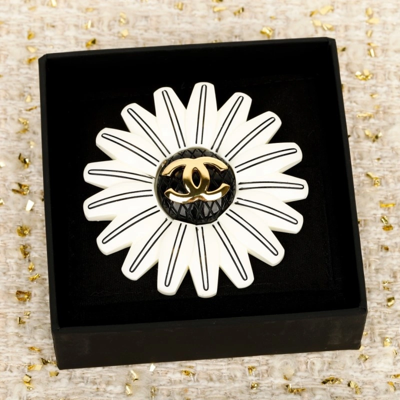 Indistinguishable Chanel Brooches