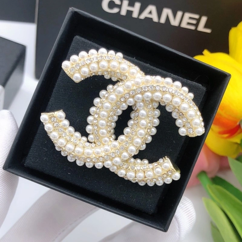 Indistinguishable Chanel Brooches