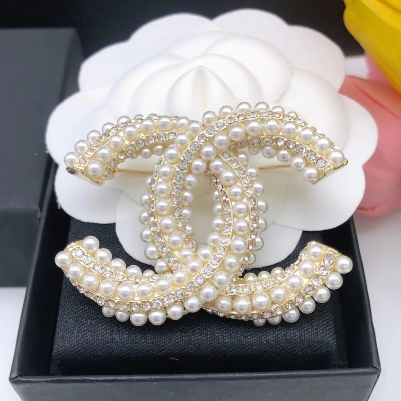Indistinguishable Chanel Brooches