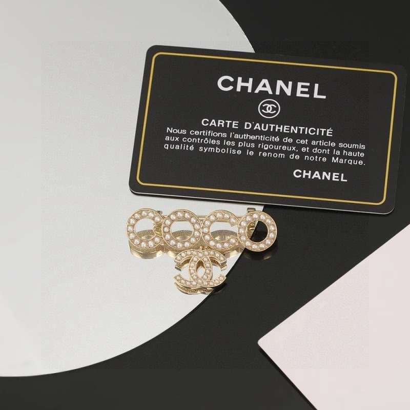 Indistinguishable Chanel Brooches