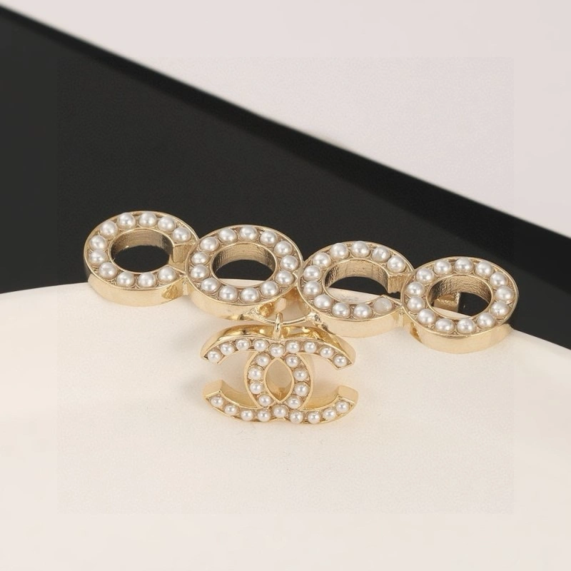 Indistinguishable Chanel Brooches