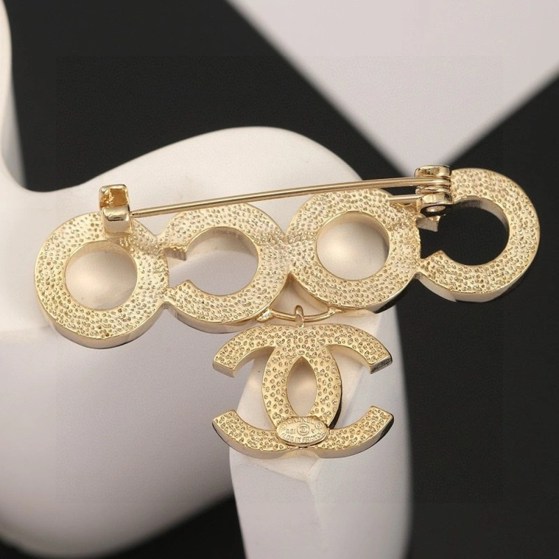 Indistinguishable Chanel Brooches