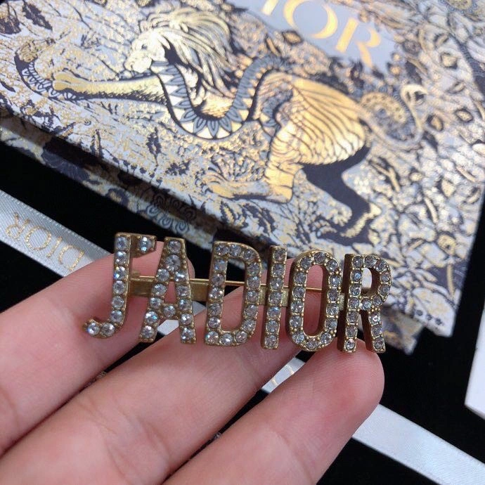 Top mirror Christian Dior Brooches