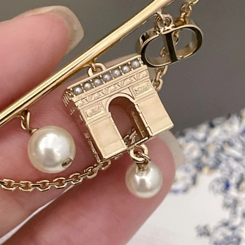 Indistinguishable Christian Dior Brooches