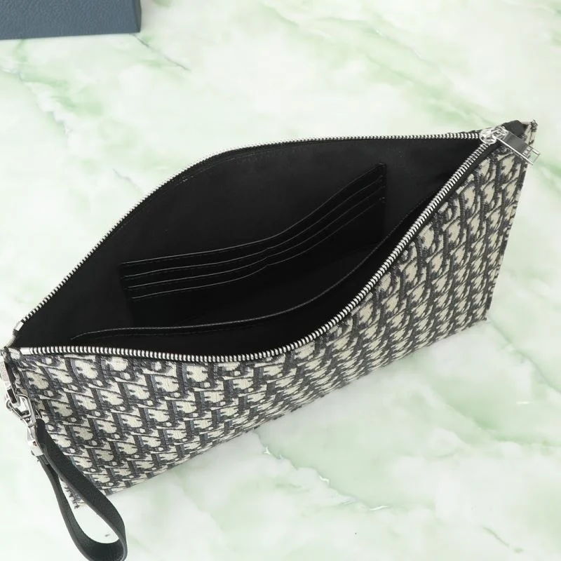 Indistinguishable Christian Dior Clutch Bags