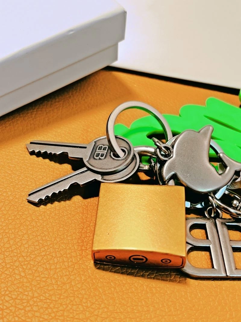 Real Elegant GoldenBalenciaga Keychain - Luxury Accessory