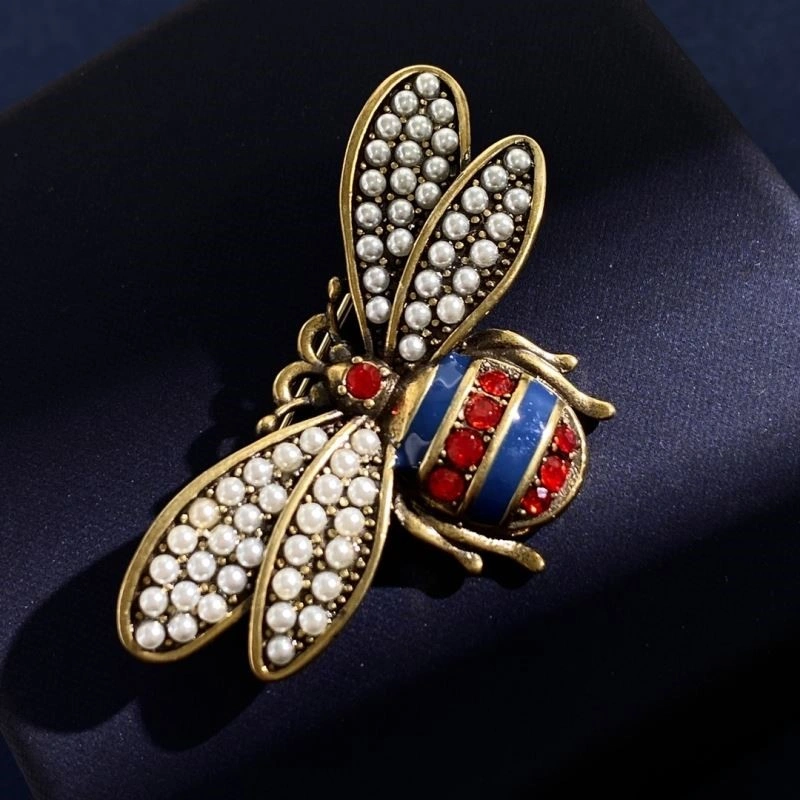 Value-priced Gucci Brooches