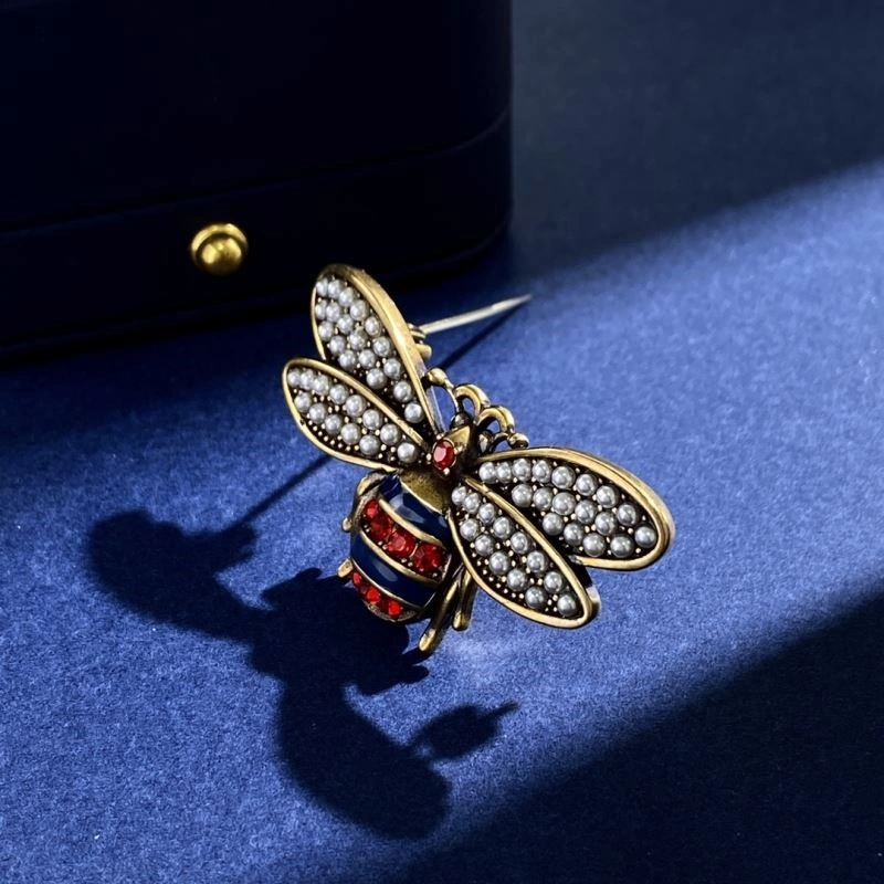 Value-priced Gucci Brooches