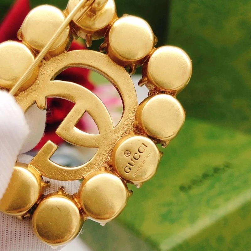 Cut-rate Gucci Brooches