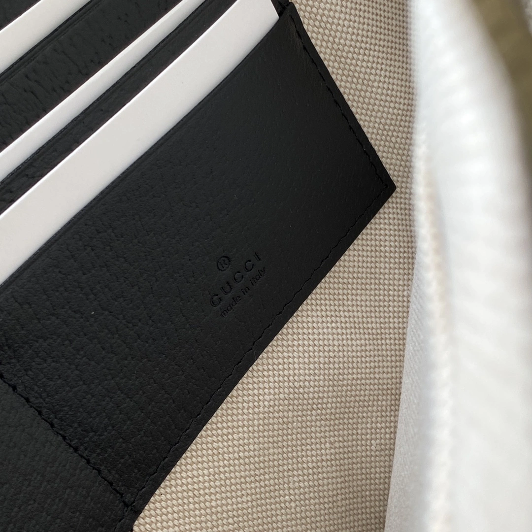 Indistinguishable Gucci Clutch Bags